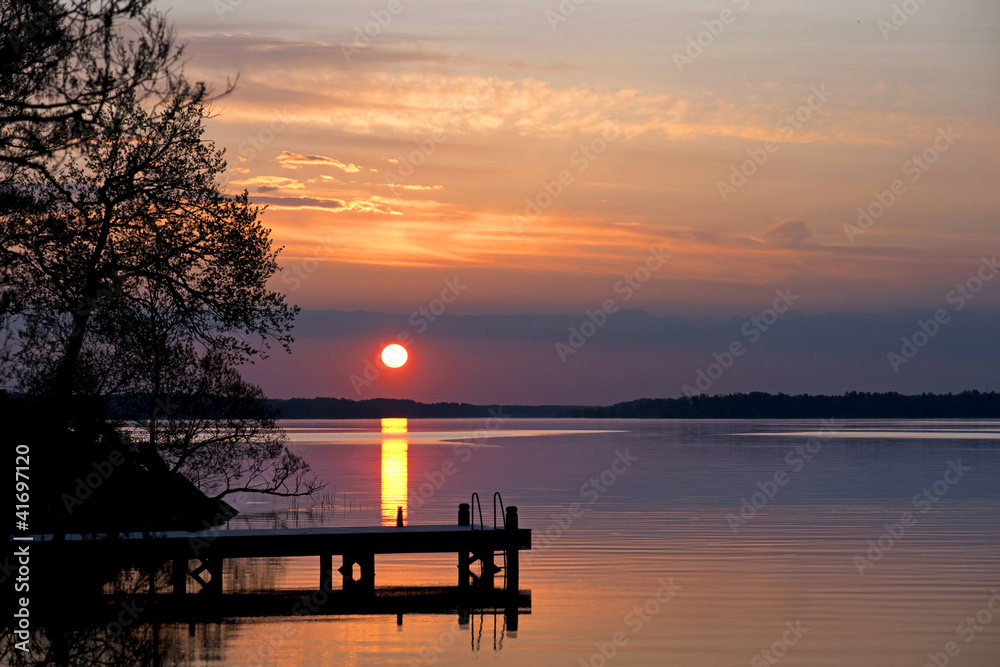 Sunset over lake Stock Photo | Adobe Stock