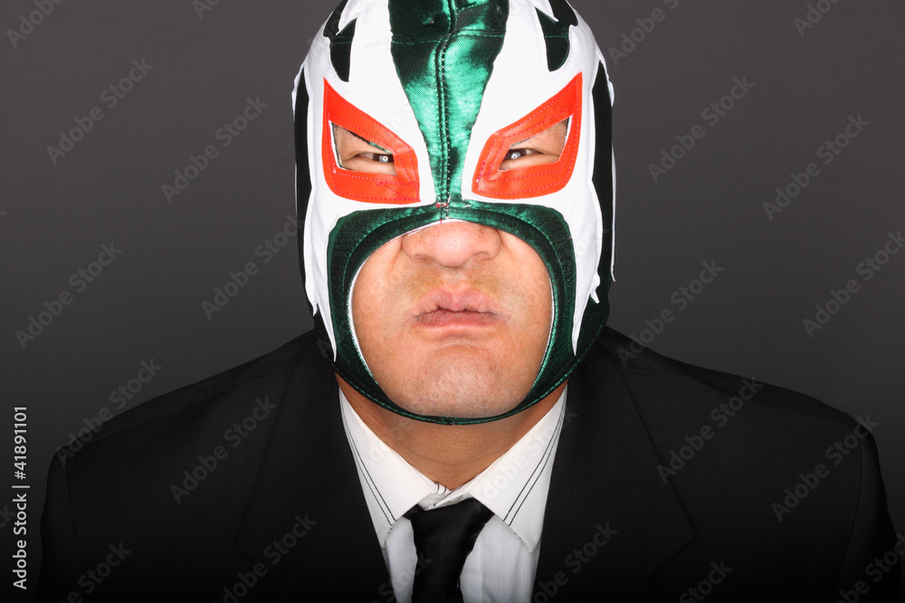 Man wearing a suit and luchador mask. Stock Photo | Adobe Stock