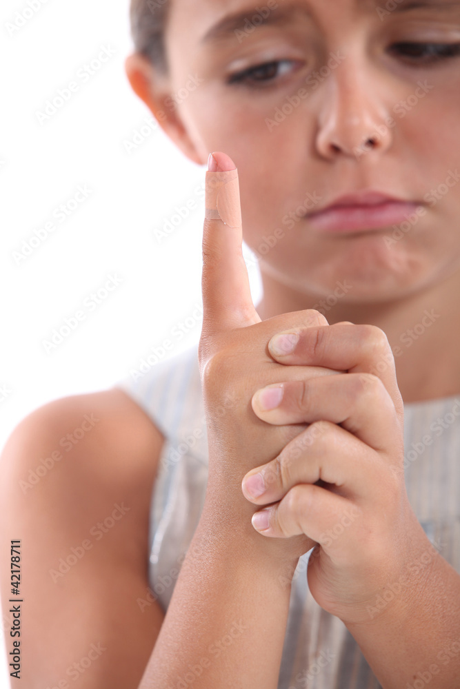 Little girl with hurt finger Stock Photo | Adobe Stock