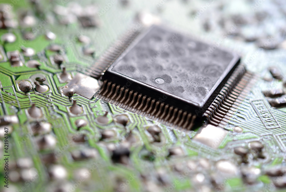 Electronic chip on circuit board Stock Photo | Adobe Stock