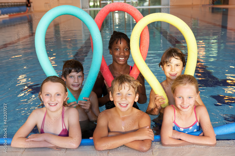 Children in swimming pool Stock Photo | Adobe Stock