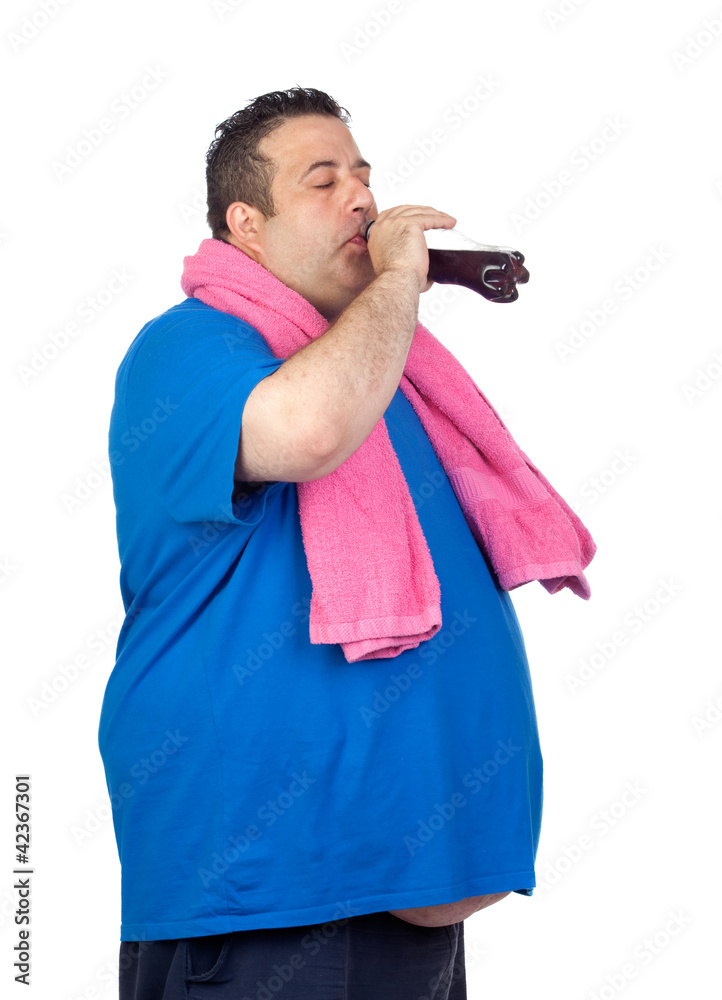 Fat man in the gym drinking cola Stock Photo | Adobe Stock