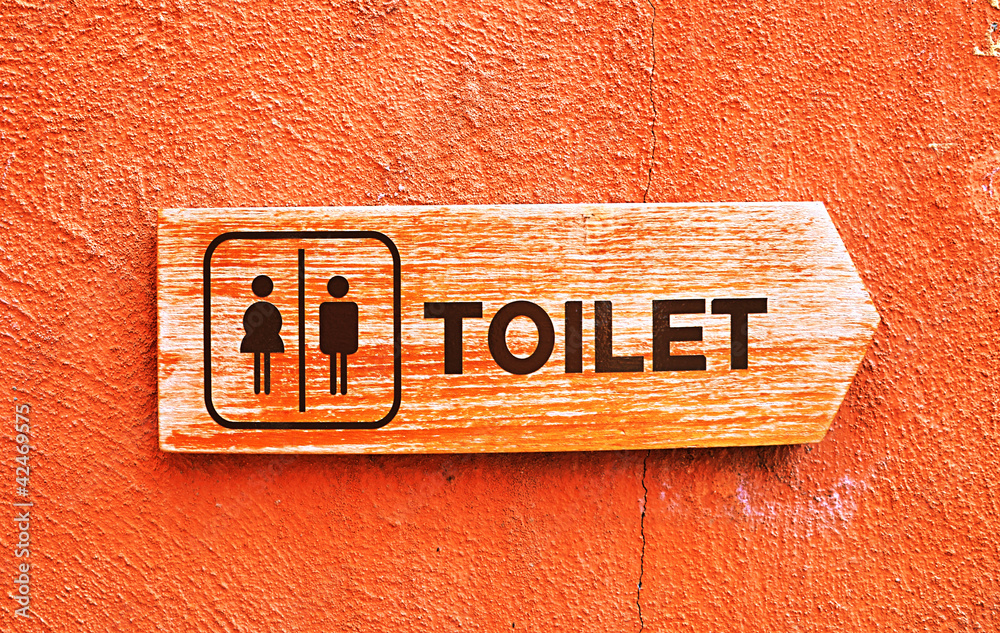 Toilet logo with orange color wall background Stock Photo | Adobe Stock
