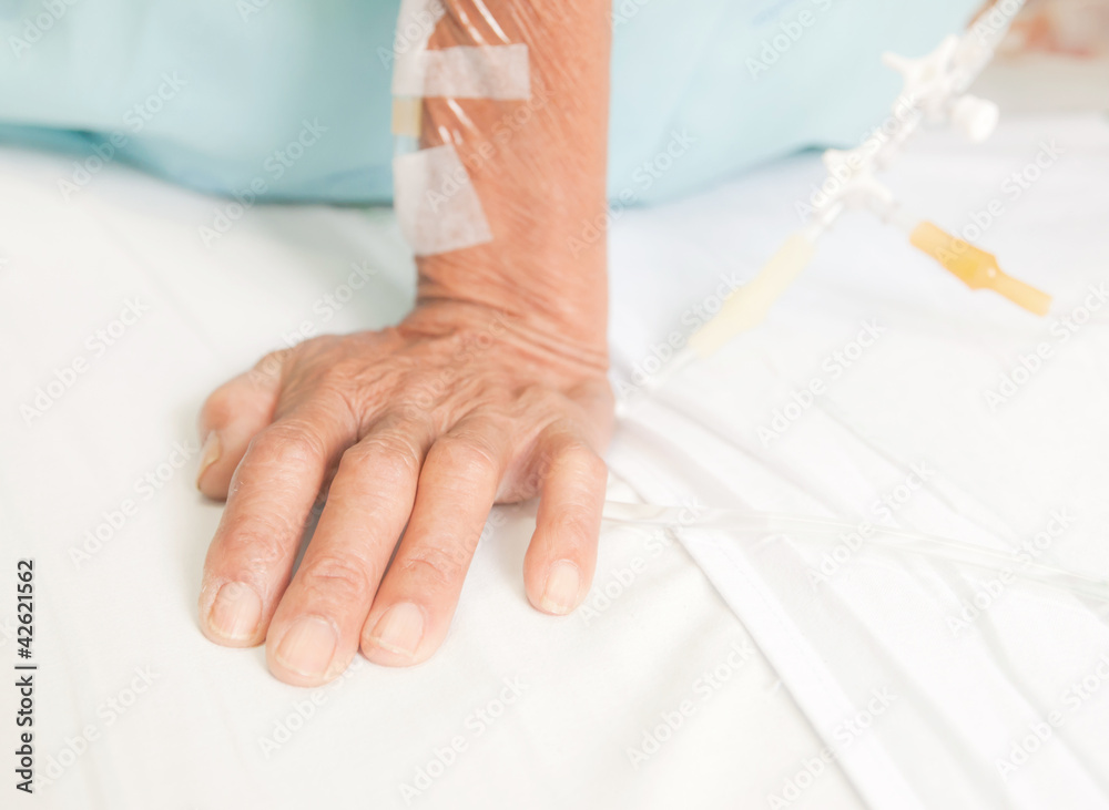Arm of a female patient in the hospital with an IV Stock-Foto | Adobe Stock