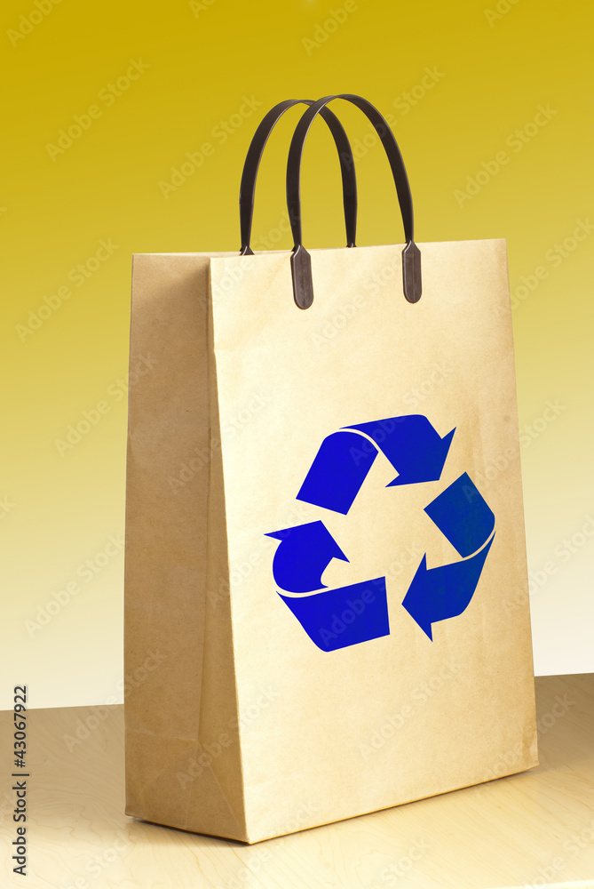 Recycle logo on paper bag on wooden Stock Photo | Adobe Stock