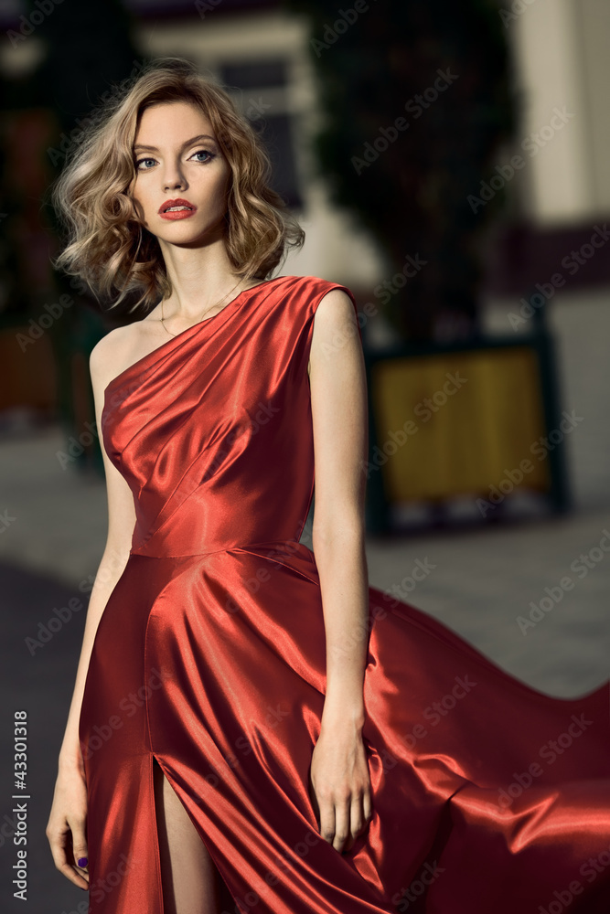 Sexy young beauty woman in fluttering red dress Stock Photo | Adobe Stock