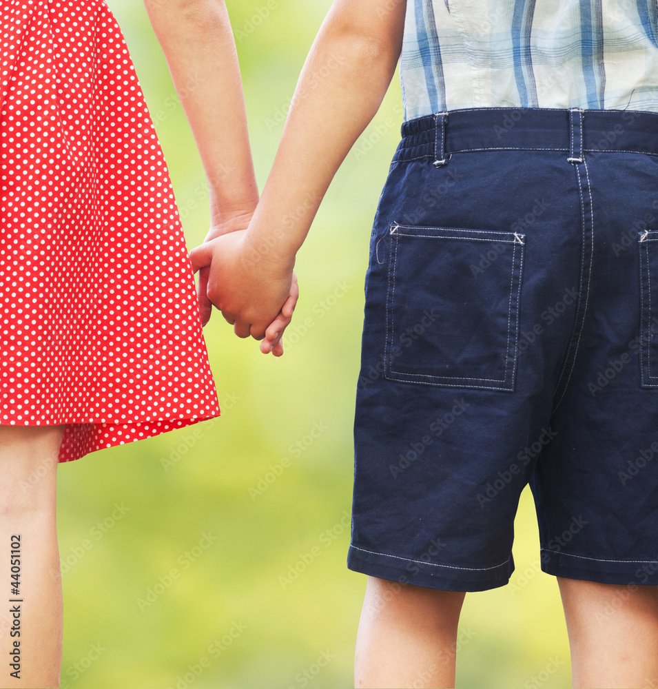 Children holding hands, first love or siblings concept Stock Photo ...