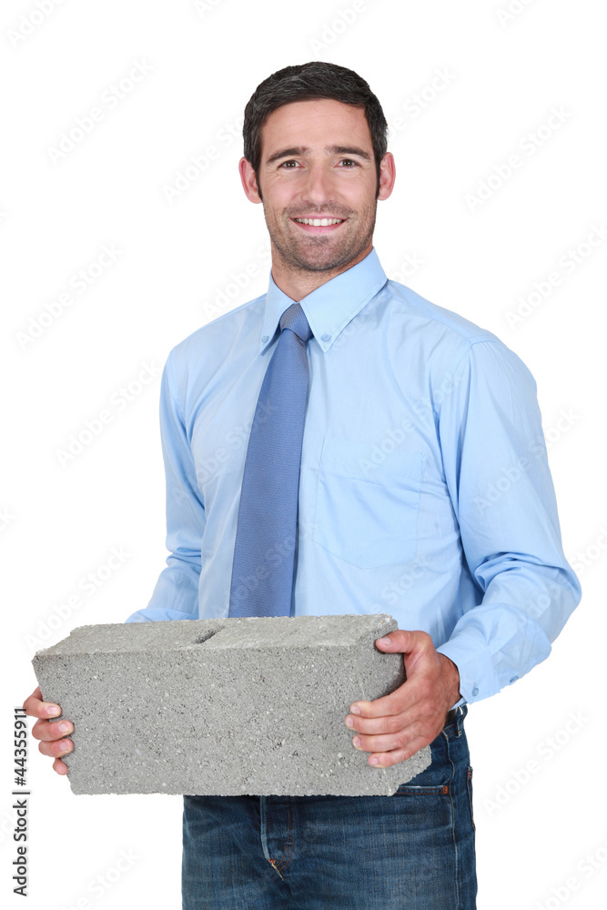 Engineer carrying a stone Stock Photo | Adobe Stock