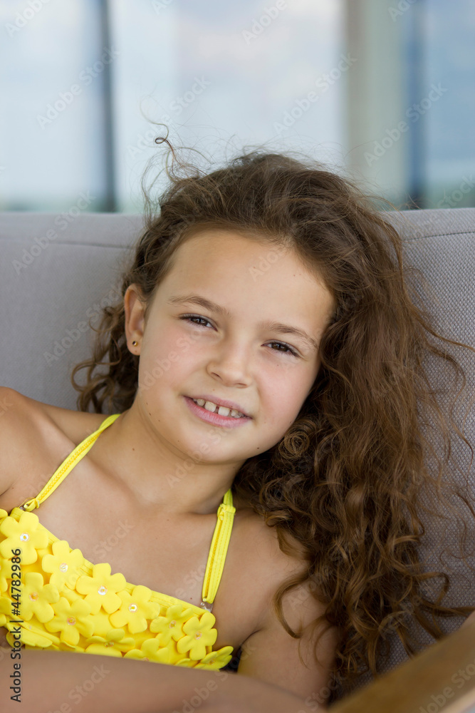 Portrait of a beautiful young girl in a yellow bikini Stock Photo ...