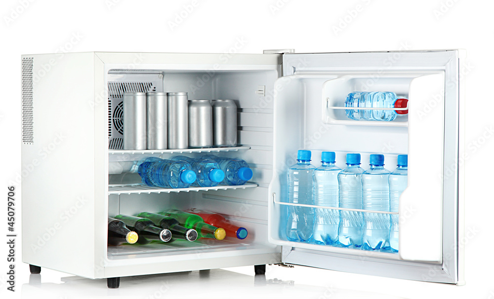 mini fridge full of bottles and jars with various drinks Stock Photo ...