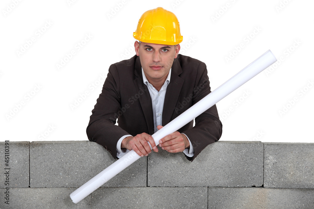 Architect with plans Stock Photo | Adobe Stock