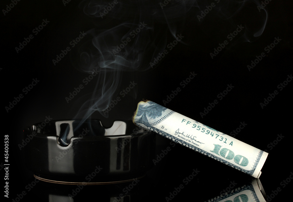 smoking cigar of the 100 dollar bill and an ashtray isolated Stock ...
