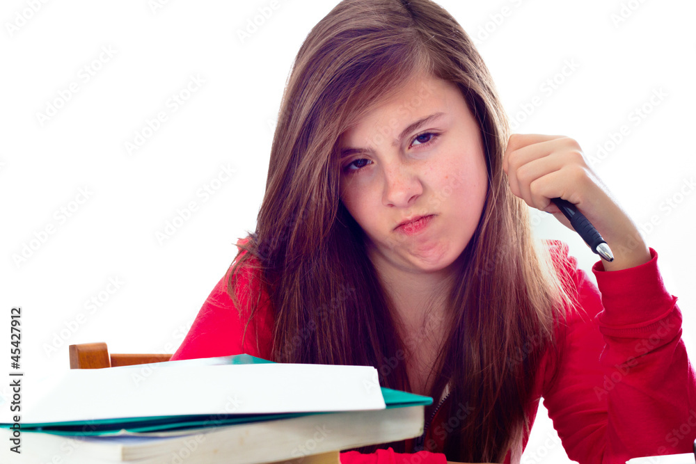 Cute teenage school girl with school books with angry look Stock Photo ...