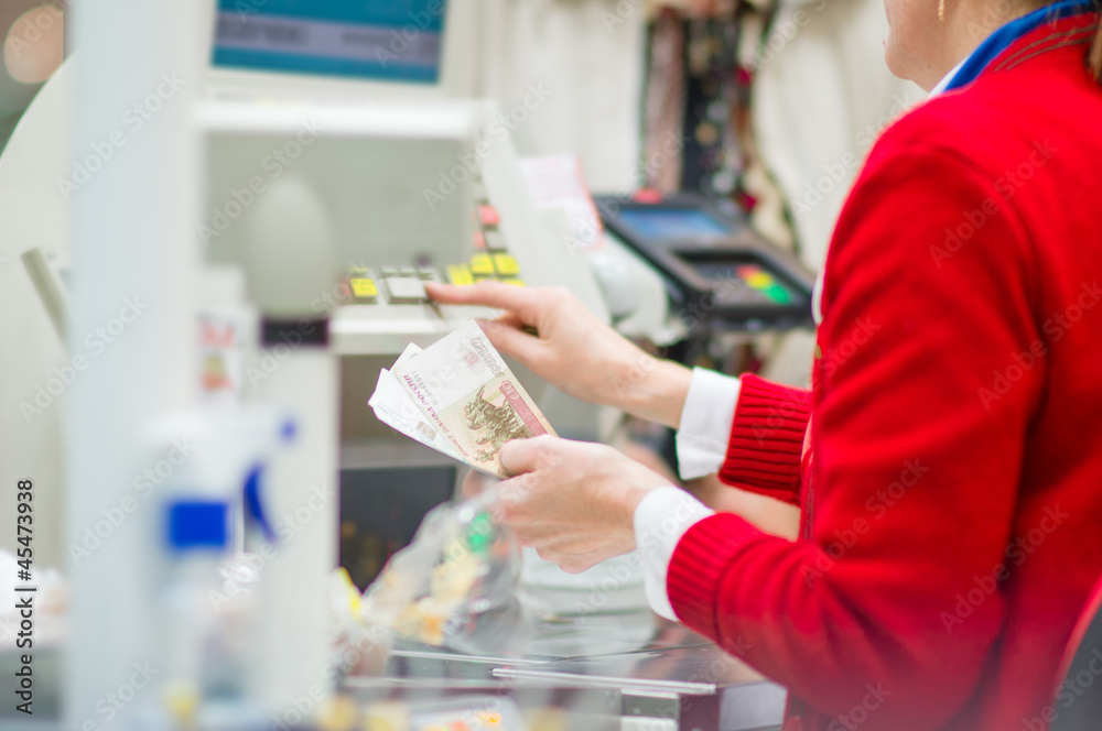 Cash-desk with cashier and terminal in supermarket. Serve custom Stock ...