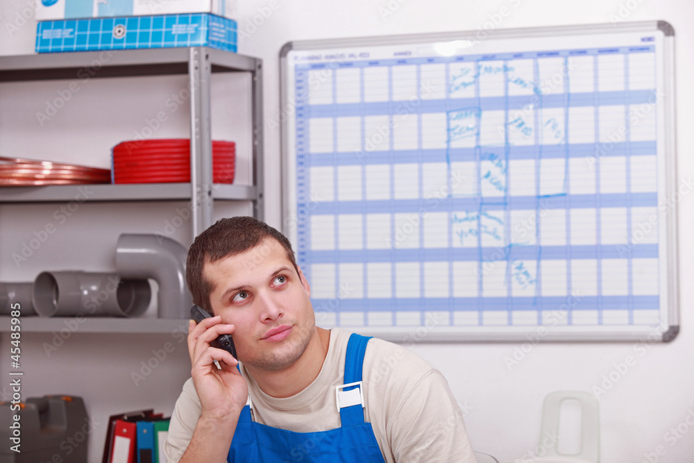 Man ordering parts to complete inventory Stock Photo | Adobe Stock