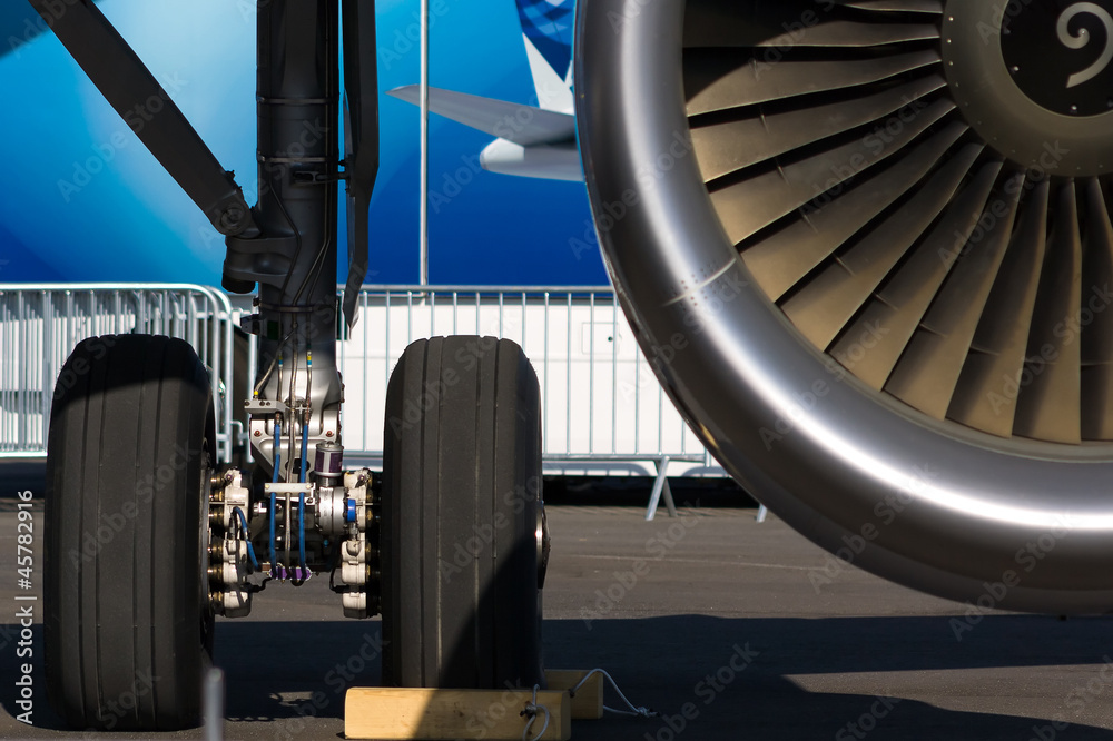 Landing gear, and a fragment of a jet engine. Stock Photo | Adobe Stock
