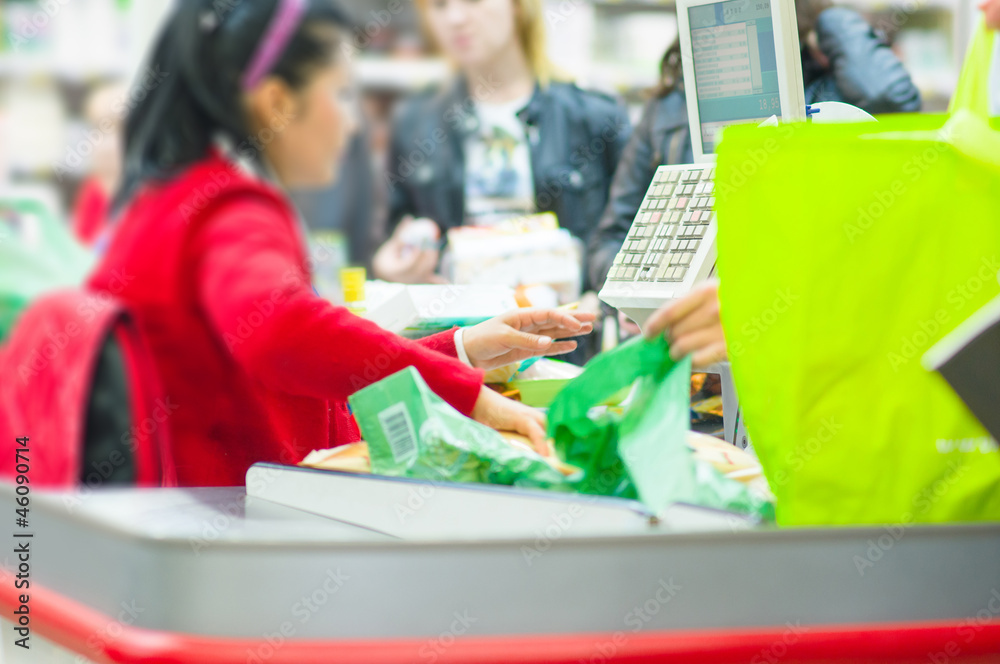 Cash-desk with cashier and terminal in supermarket. Serve custom Stock ...