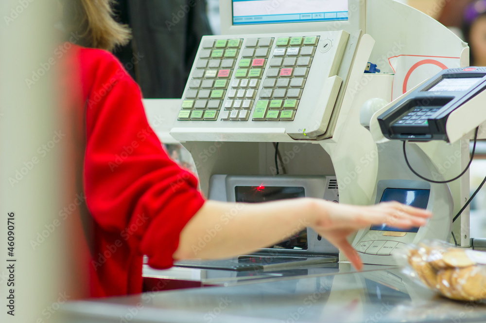 Cash-desk with cashier and terminal in supermarket. Serve custom Stock ...