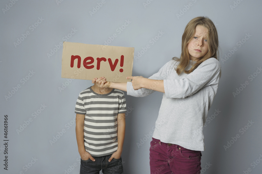 Mädchen ist von kleinem Bruder genervt Stock-Foto | Adobe Stock