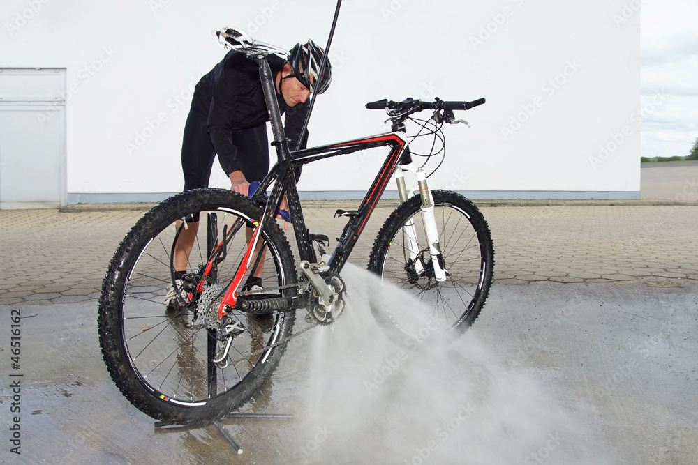 man washing the bike Stock-Foto | Adobe Stock