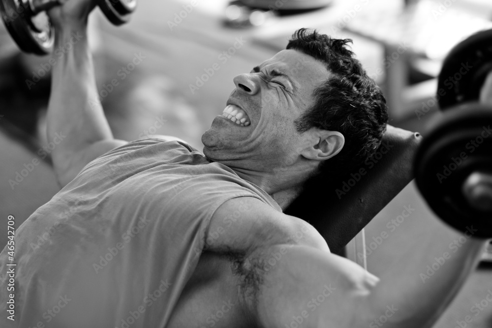bodybuilder hard training in the gym: incline dumbbell press Stock ...