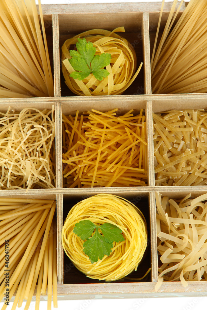 Nine types of pasta in wooden box sections close-up isolated Stock ...
