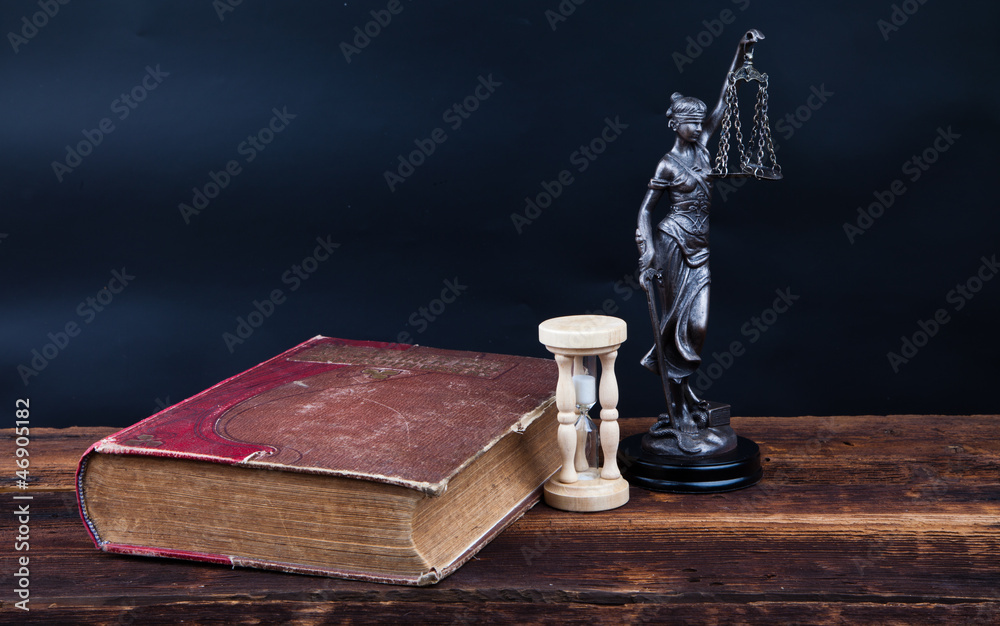old book and temida statue Stock Photo | Adobe Stock