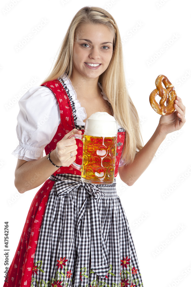 Frau im Dirndl mit Bier und Breze ภาพถ่ายสต็อก | Adobe Stock
