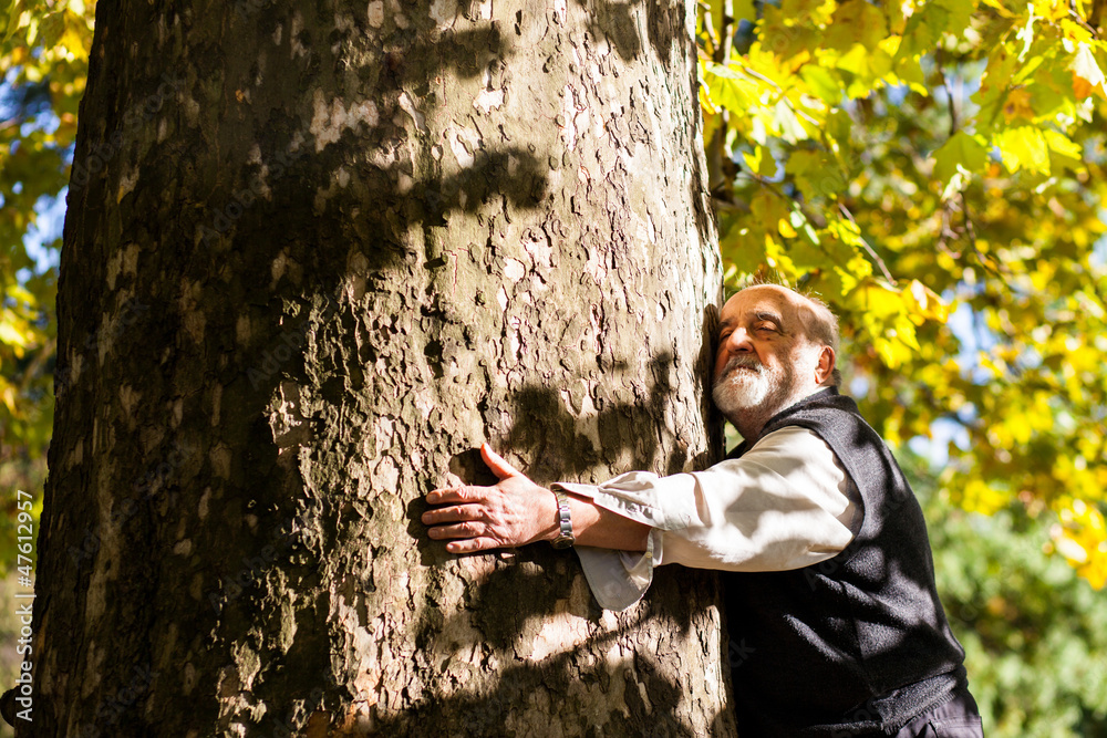 old man hugging a tree Stock Photo | Adobe Stock