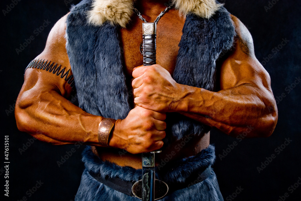 Muscular man warrior with a sword Stock Photo | Adobe Stock