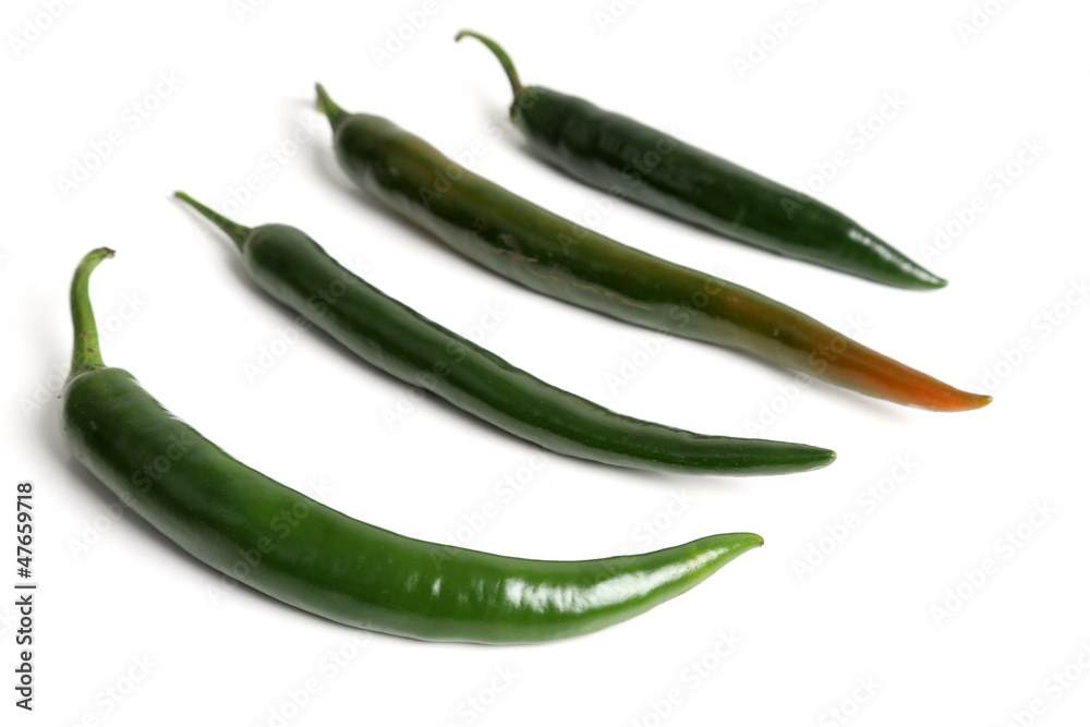 Vier grüne Chilis Stock Photo | Adobe Stock