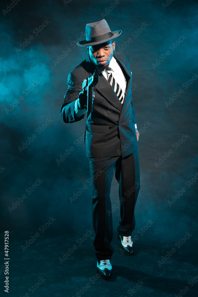 Black american mafia gangster man in suit with gun. Stock Photo | Adobe ...