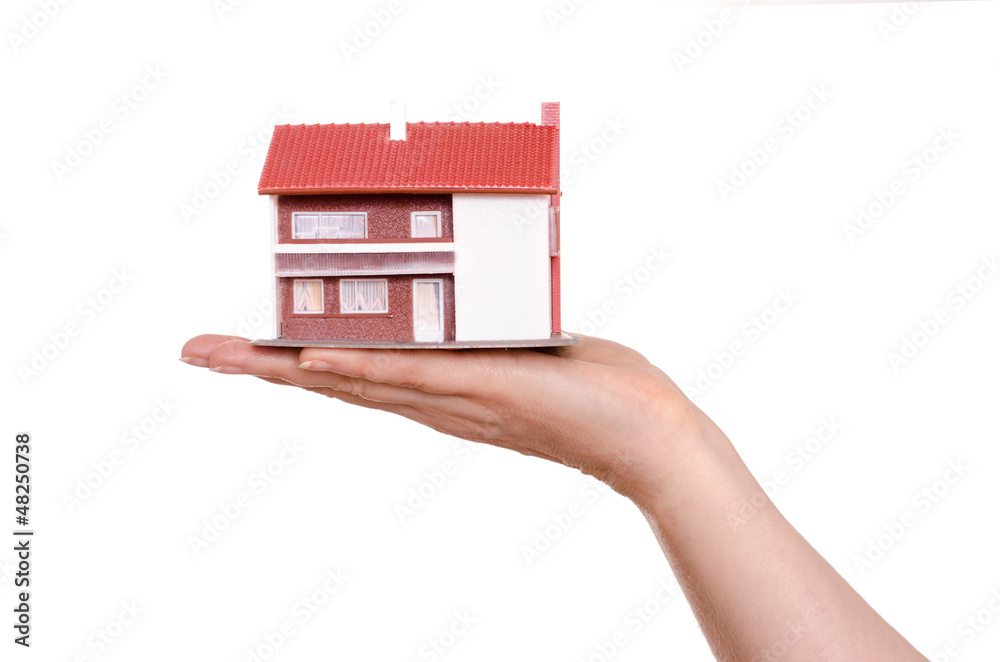 Haus auf einer Hand Stock-Foto | Adobe Stock