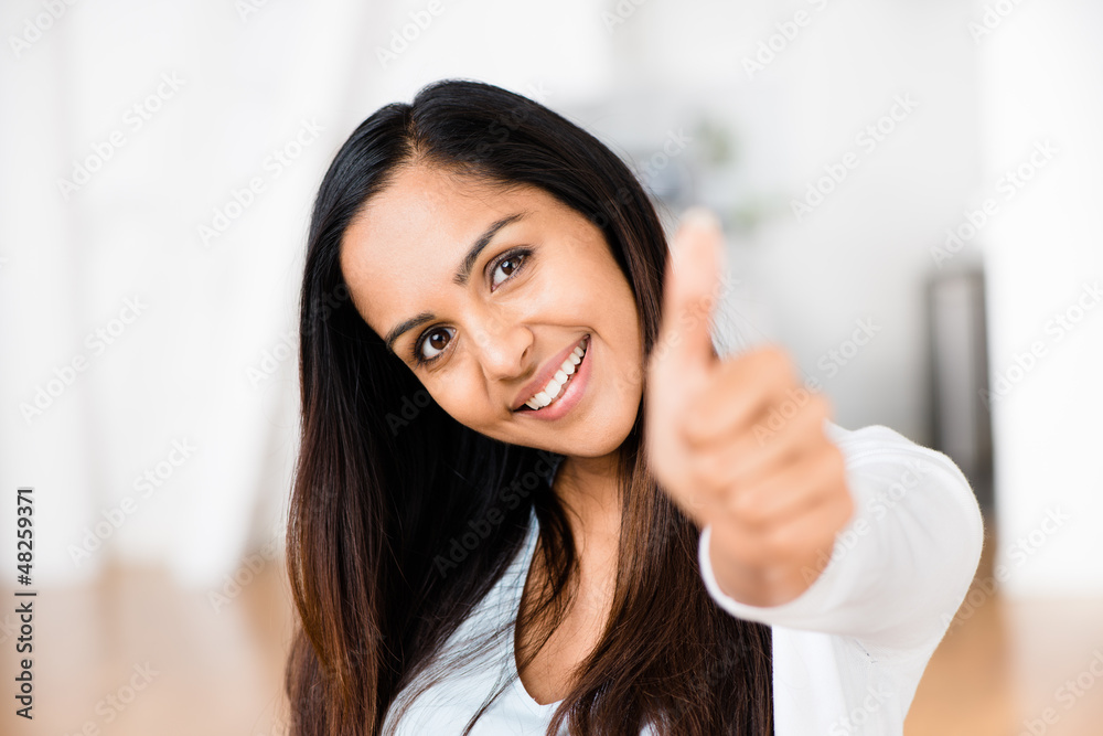 Beautiful Indian woman thumbs up happy smiling Stock Photo | Adobe Stock