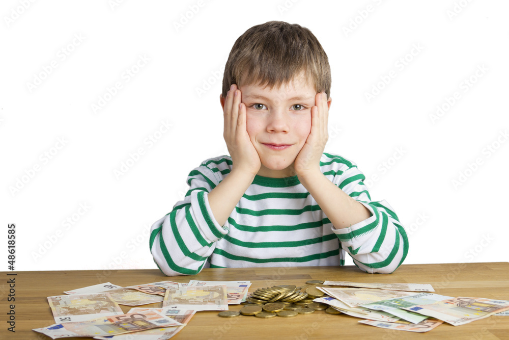 Junge sitzt vor viel Geld Stock Photo | Adobe Stock