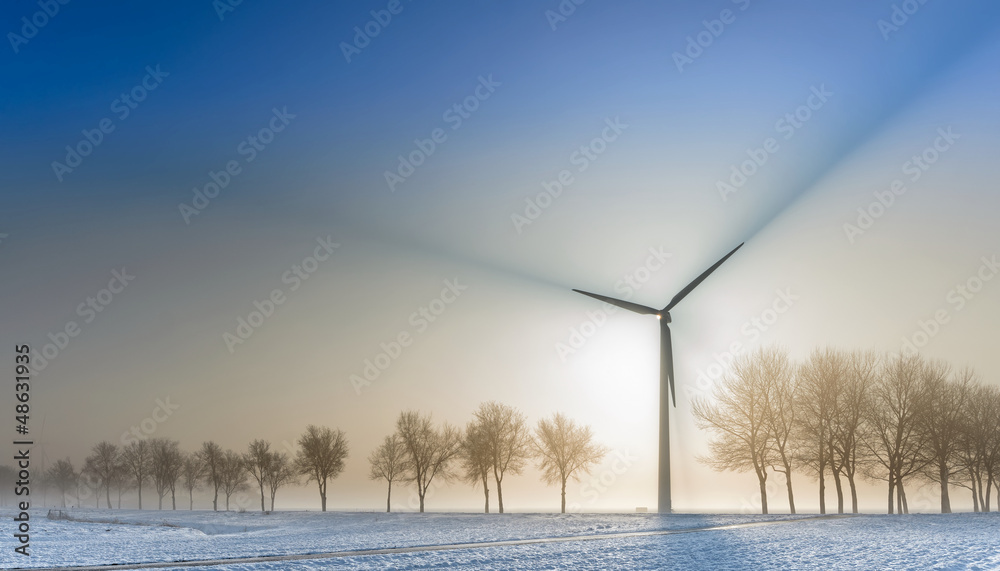 Spectacular beams of shadow from a wind turbine Stock Photo | Adobe Stock
