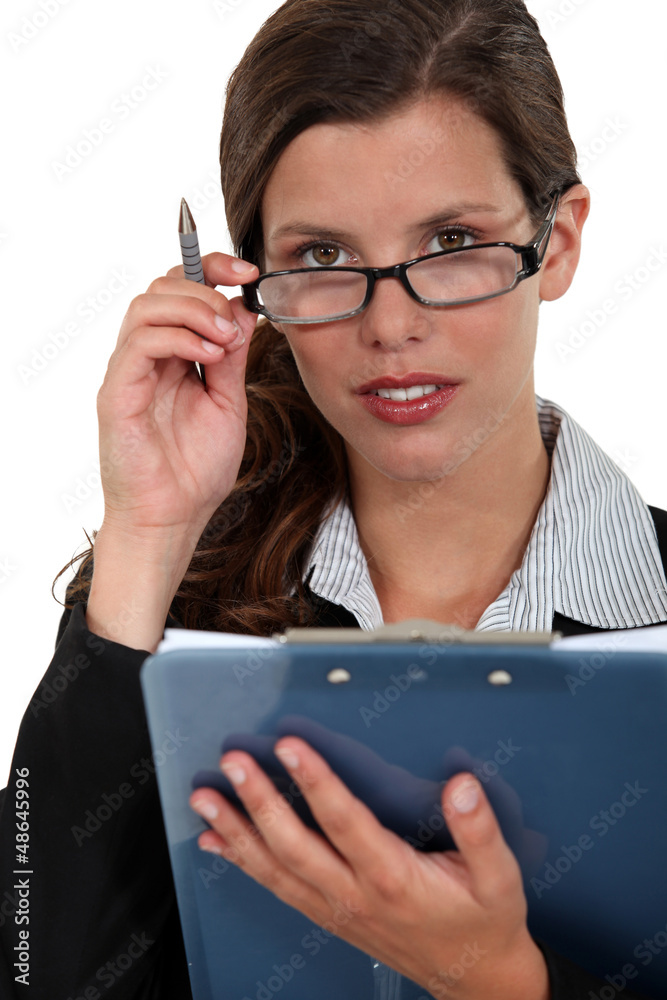 Observant woman peering over her glasses Stock Photo | Adobe Stock
