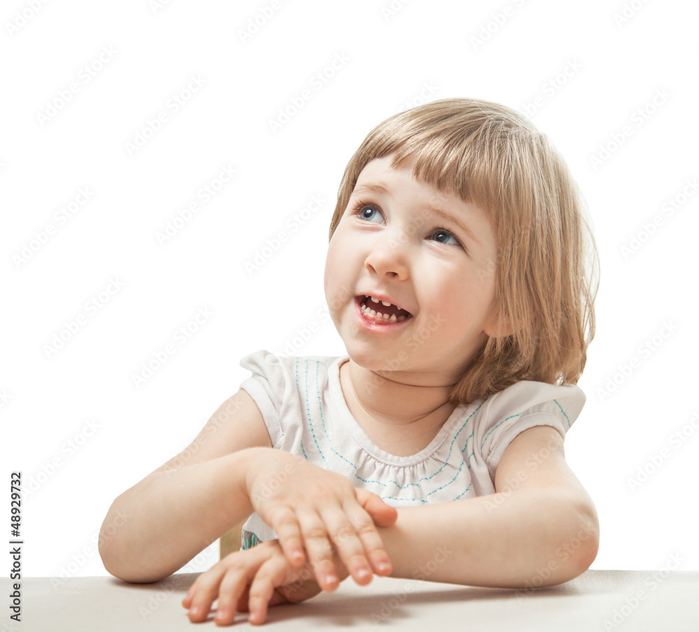 Little girl sitting at table Stock Photo | Adobe Stock