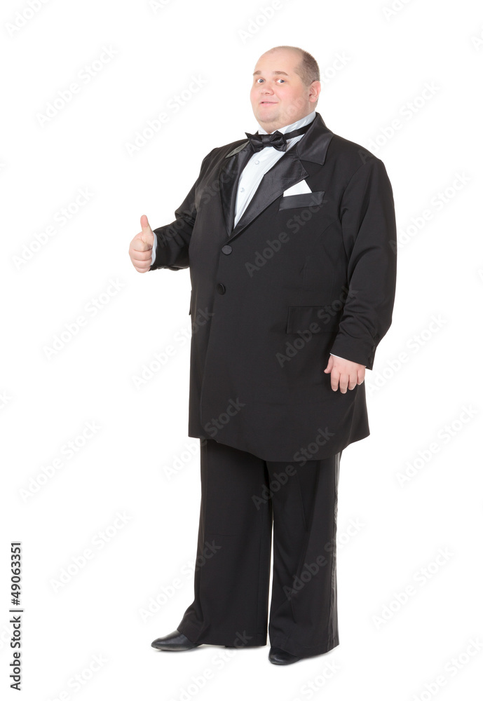 Elegant fat man in a tuxedo shows thumb-up Stock Photo | Adobe Stock