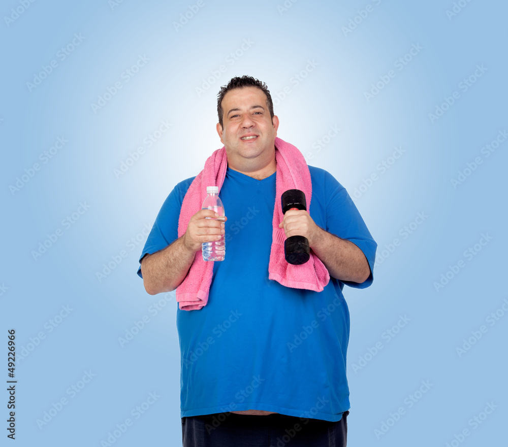 Fat man in the gym with a water bottle Stock Photo | Adobe Stock