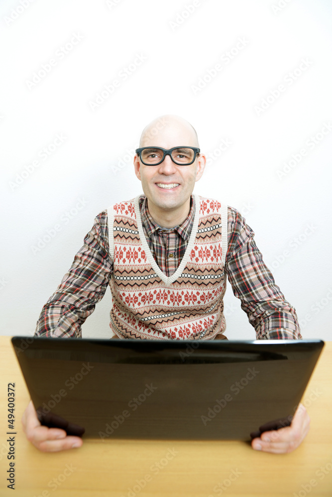 Lachender Nerd am Laptop Stock Photo | Adobe Stock