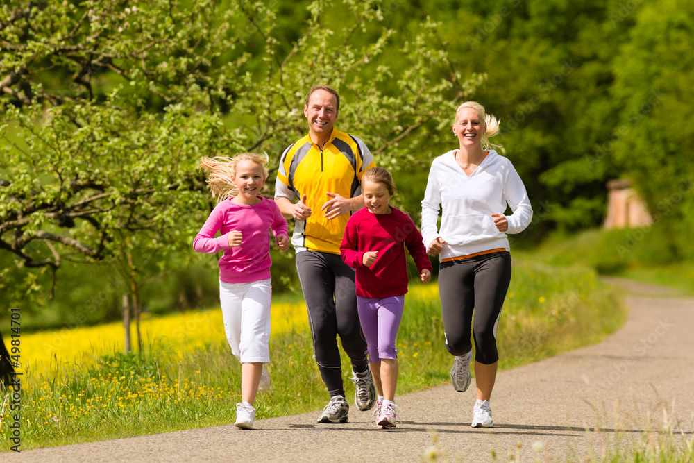 Family running in the meadow for sport Stock Photo | Adobe Stock