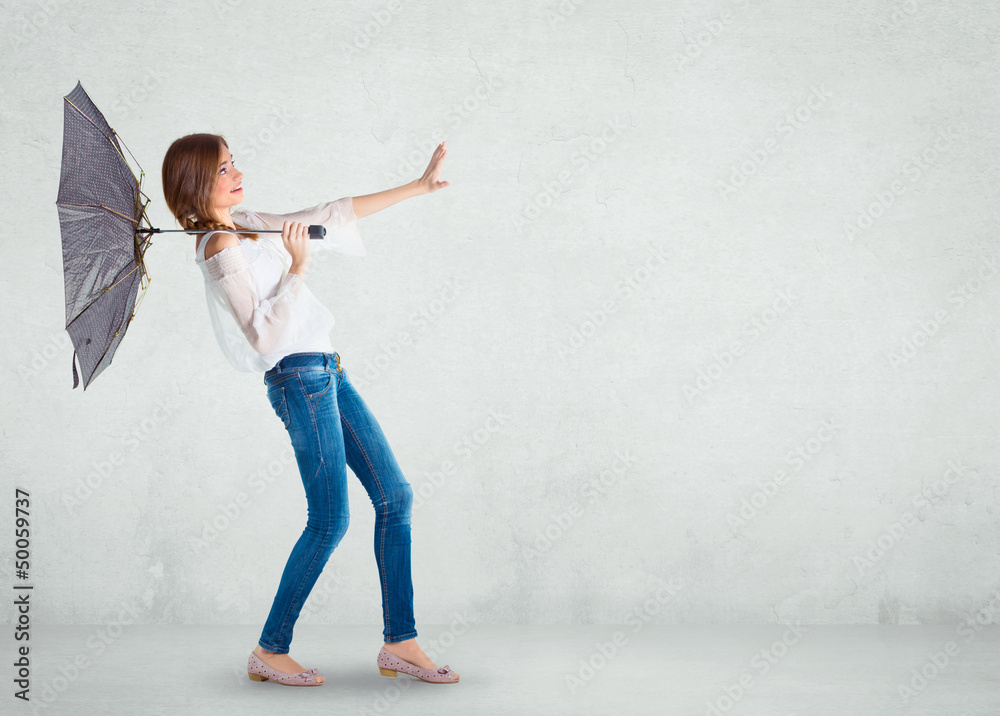 Girl over a white wall, wind blowing Stock Photo | Adobe Stock