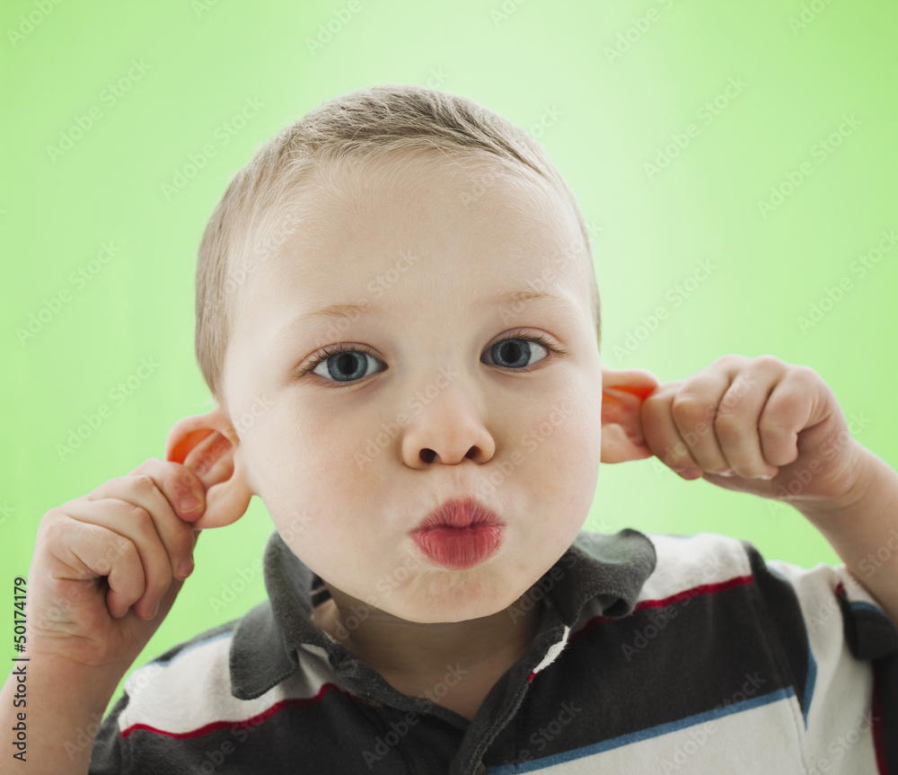 Caucasian boy pulling his ears Stock Photo | Adobe Stock