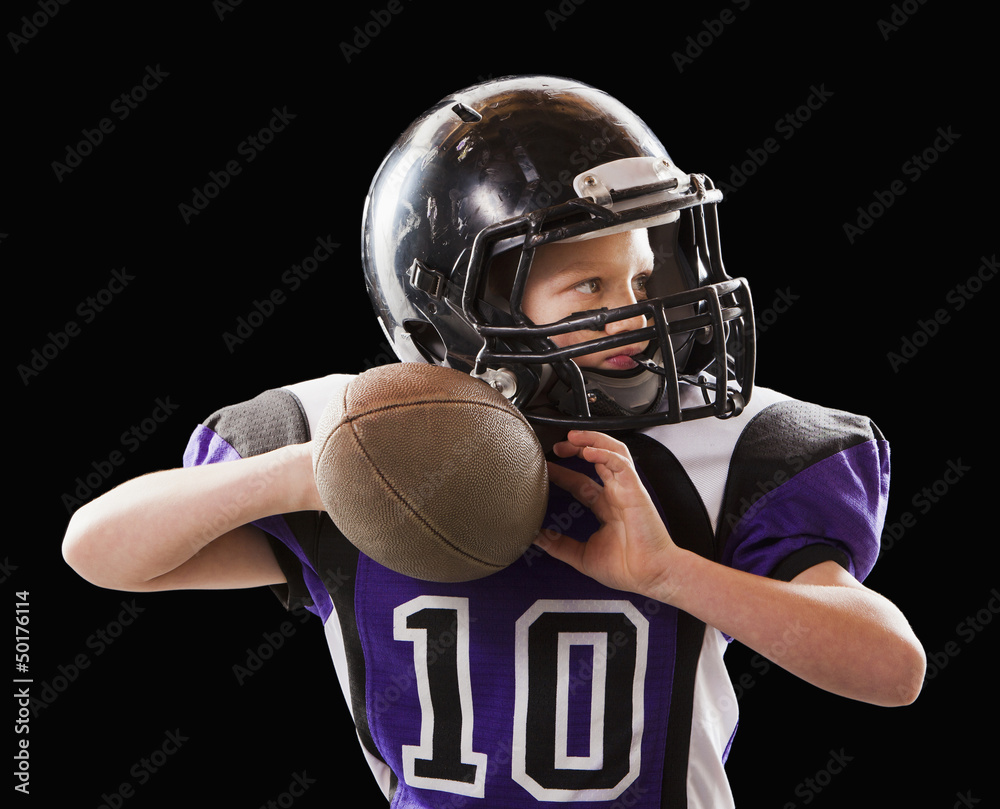 Caucasian football player throwing football Stock Photo | Adobe Stock