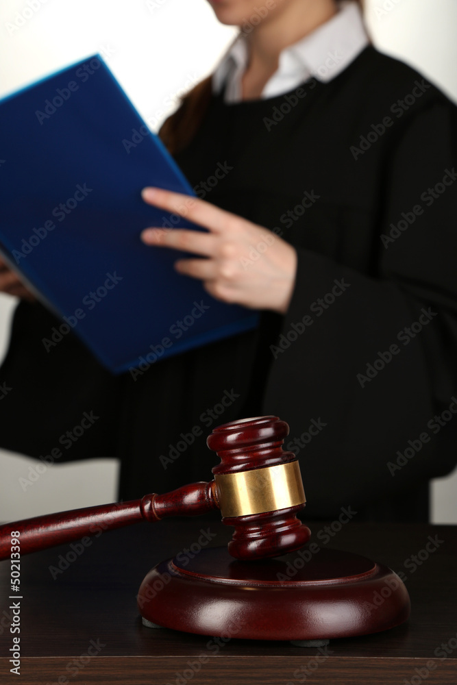 Judge read verdict on grey background Stock Photo | Adobe Stock