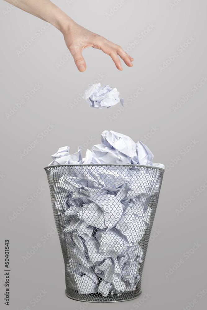 The hand of woman throwing crumpled paper into trash bin Stock Photo ...