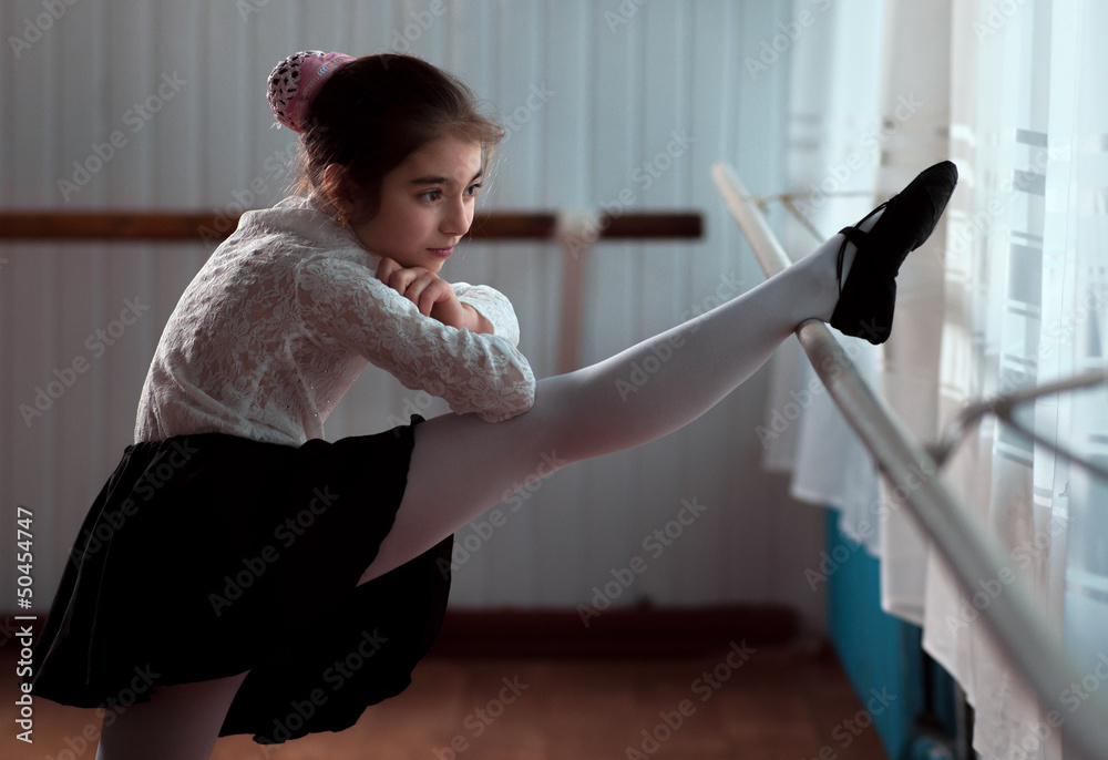 girl ballet dancer practicing on the barre Stock Photo | Adobe Stock