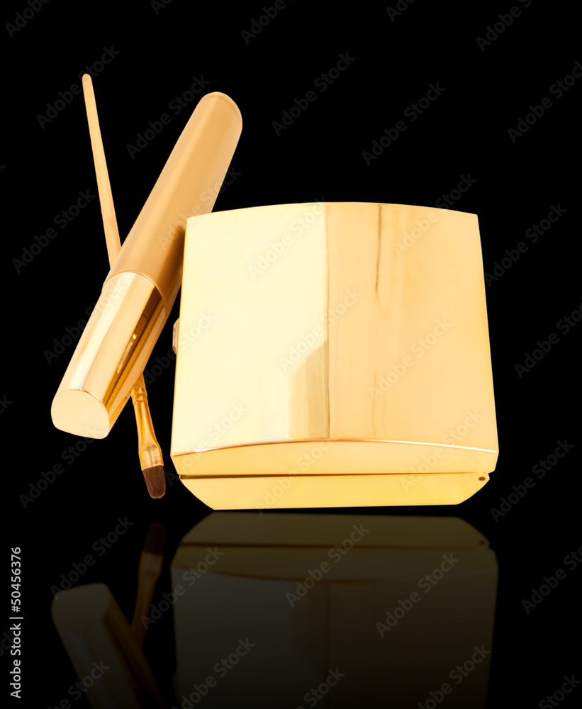gold make up collection isolated on black background with reflec Stock ...