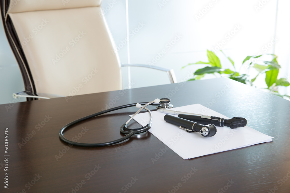 Doctor office table desk with stethoscope and otoscope Stock Photo ...